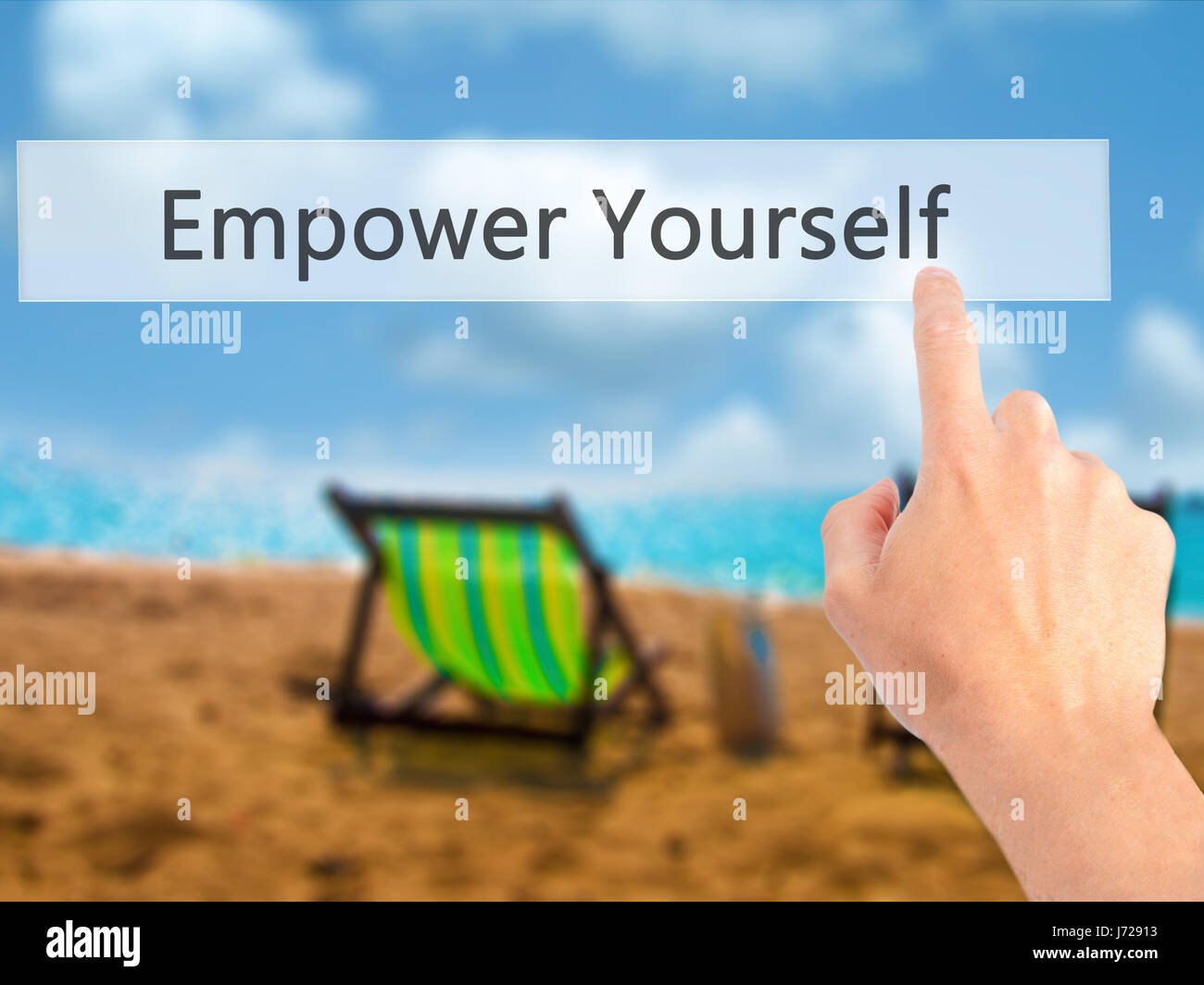 Empower Yourself - Hand pressing a button on blurred background concept ...