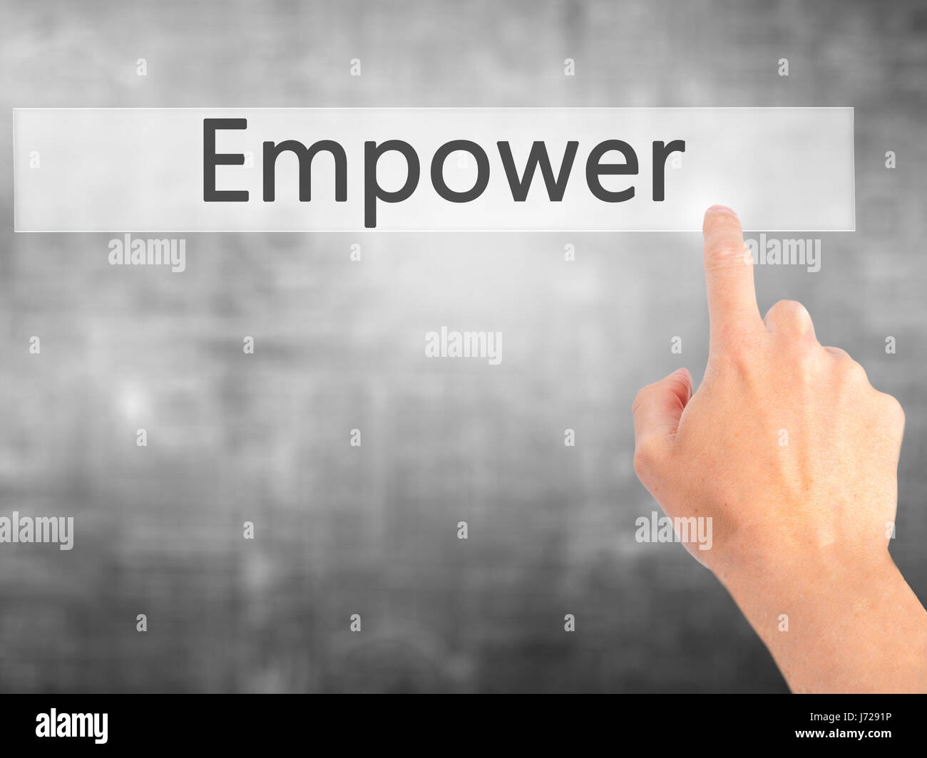 Empower - Hand pressing a button on blurred background concept ...