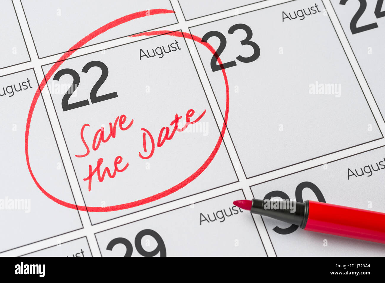 Save the Date written on a calendar - August 22 Stock Photo - Alamy