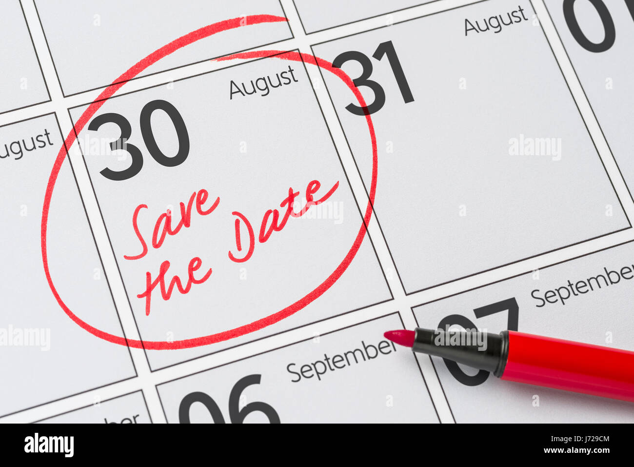 Save the Date written on a calendar - August 30 Stock Photo - Alamy