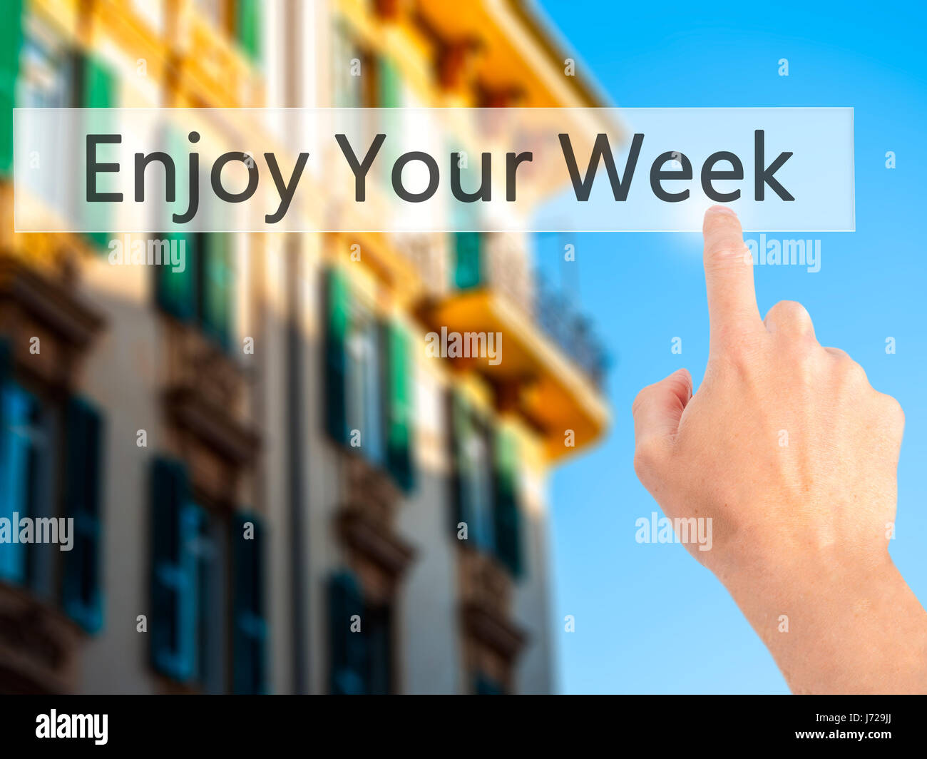 Enjoy Your Week - Hand pressing a button on blurred background concept ...