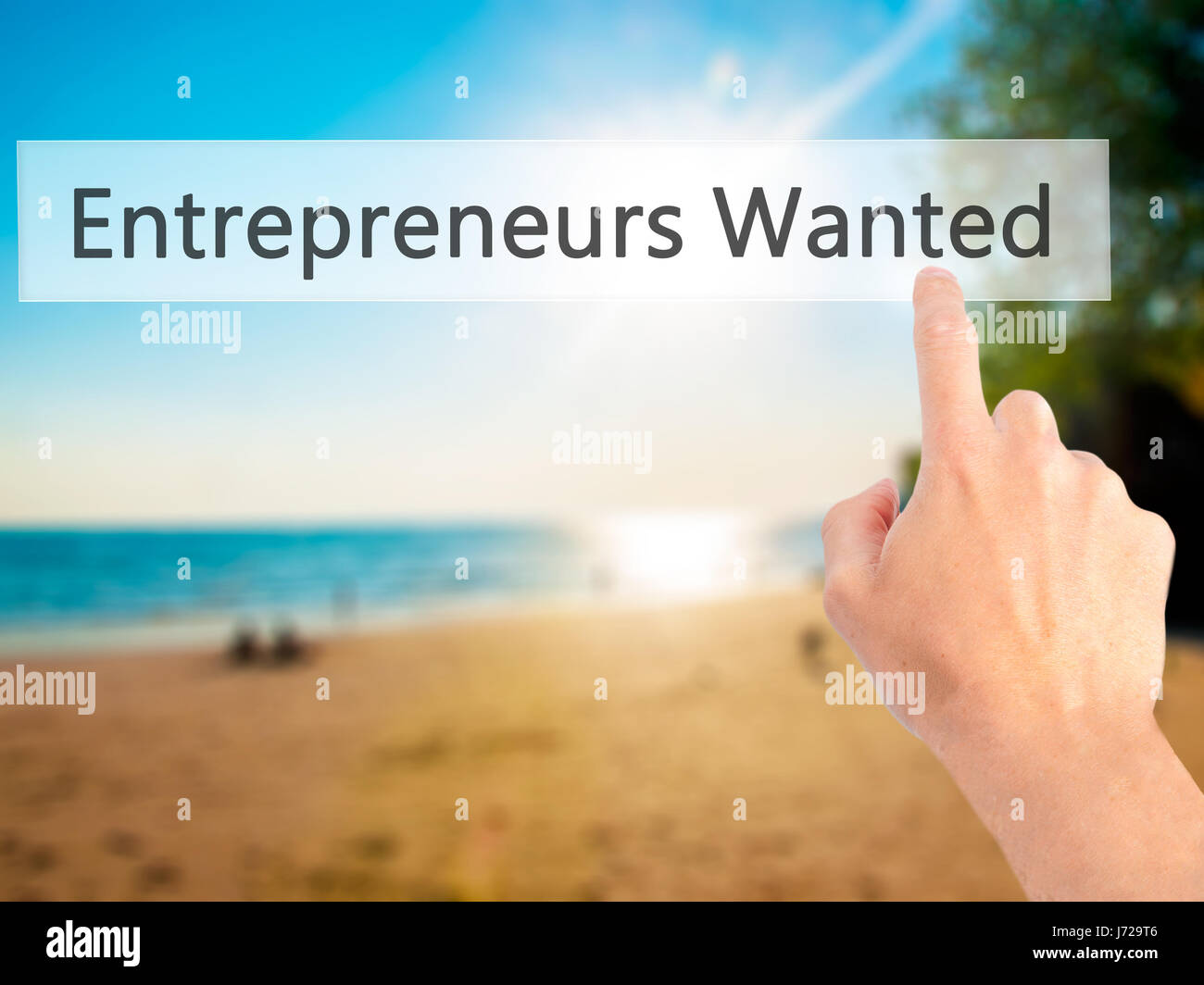 Entrepreneurs Wanted - Hand pressing a button on blurred background ...