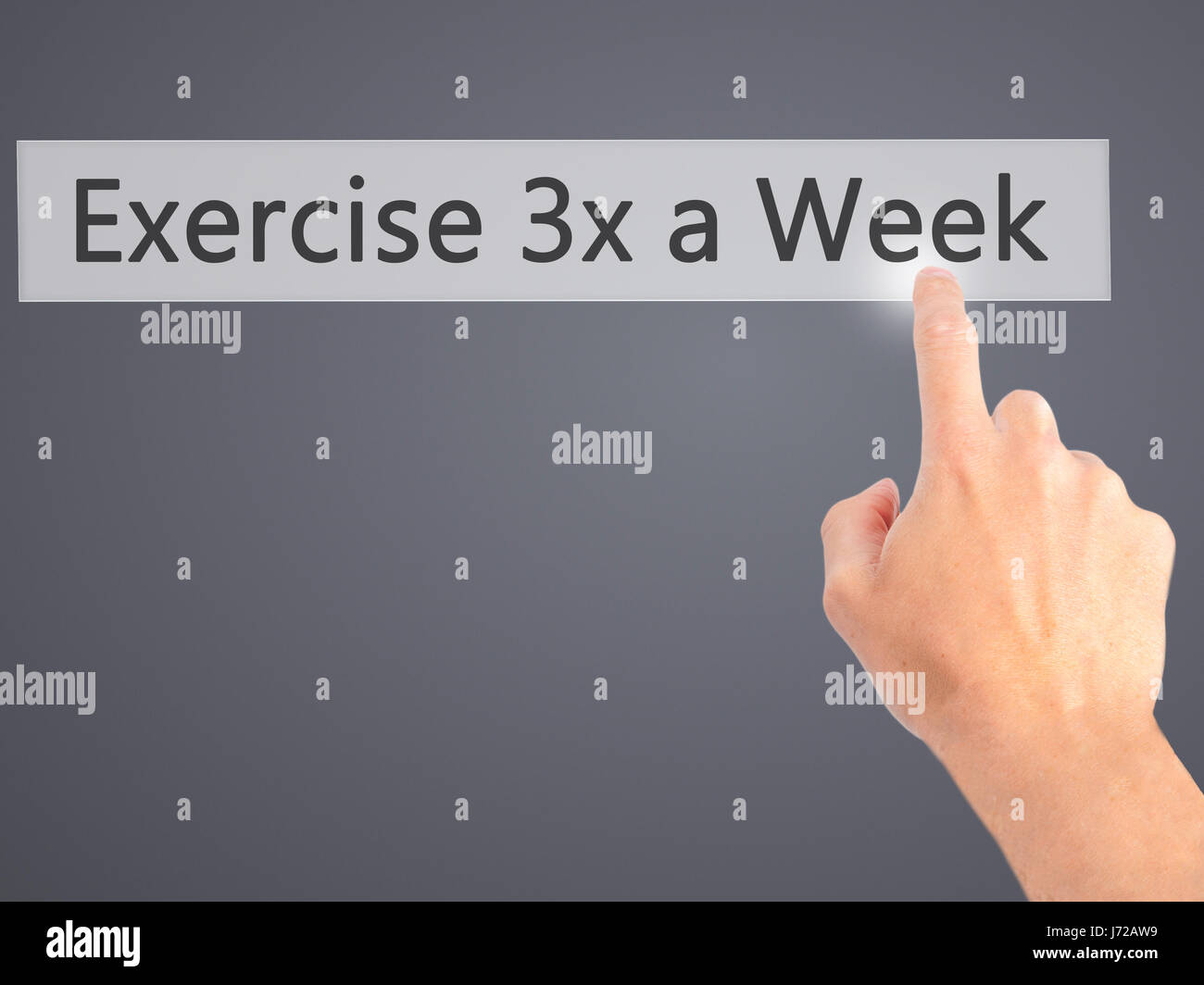 Exercise 3x a Week - Hand pressing a button on blurred background ...