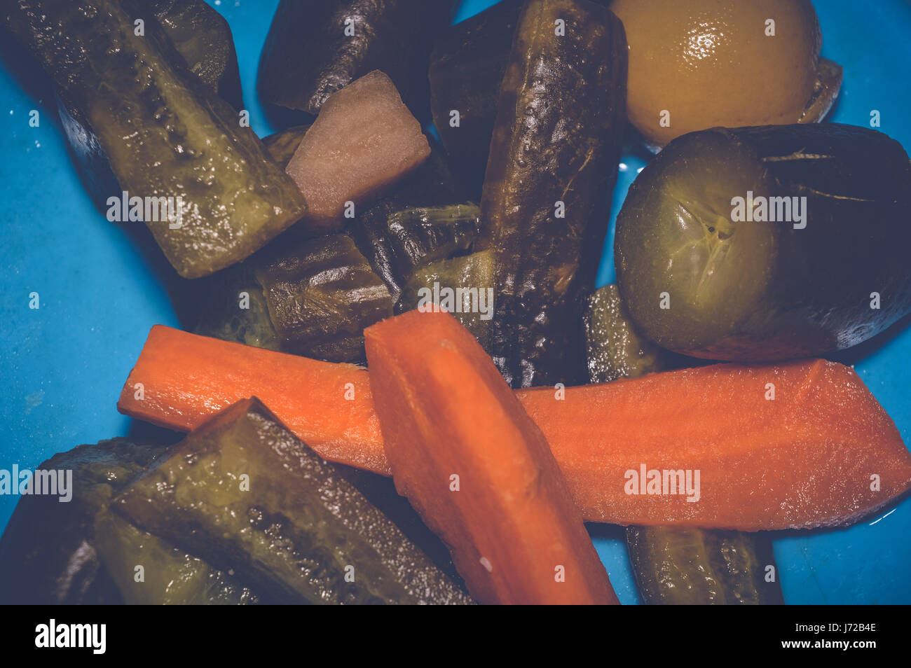 pickle in blue plate Stock Photo - Alamy