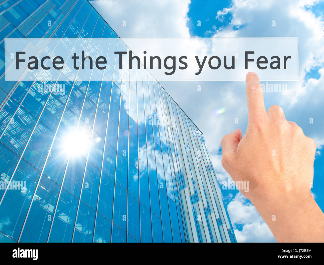 Face the Things you Fear - Hand pressing a button on blurred background ...