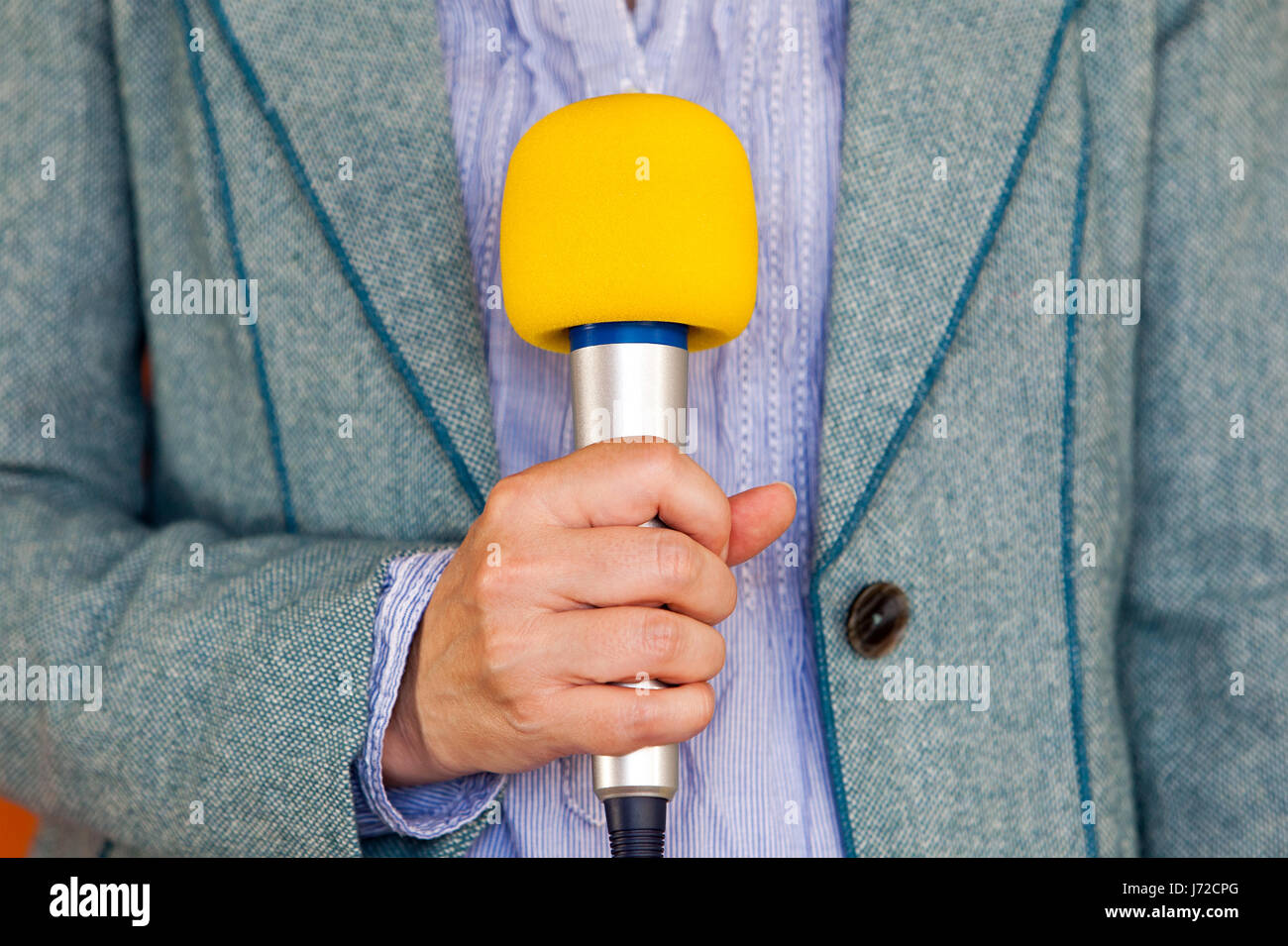 Reporter holding microphone. Media reporting. Journalism Stock Photo ...