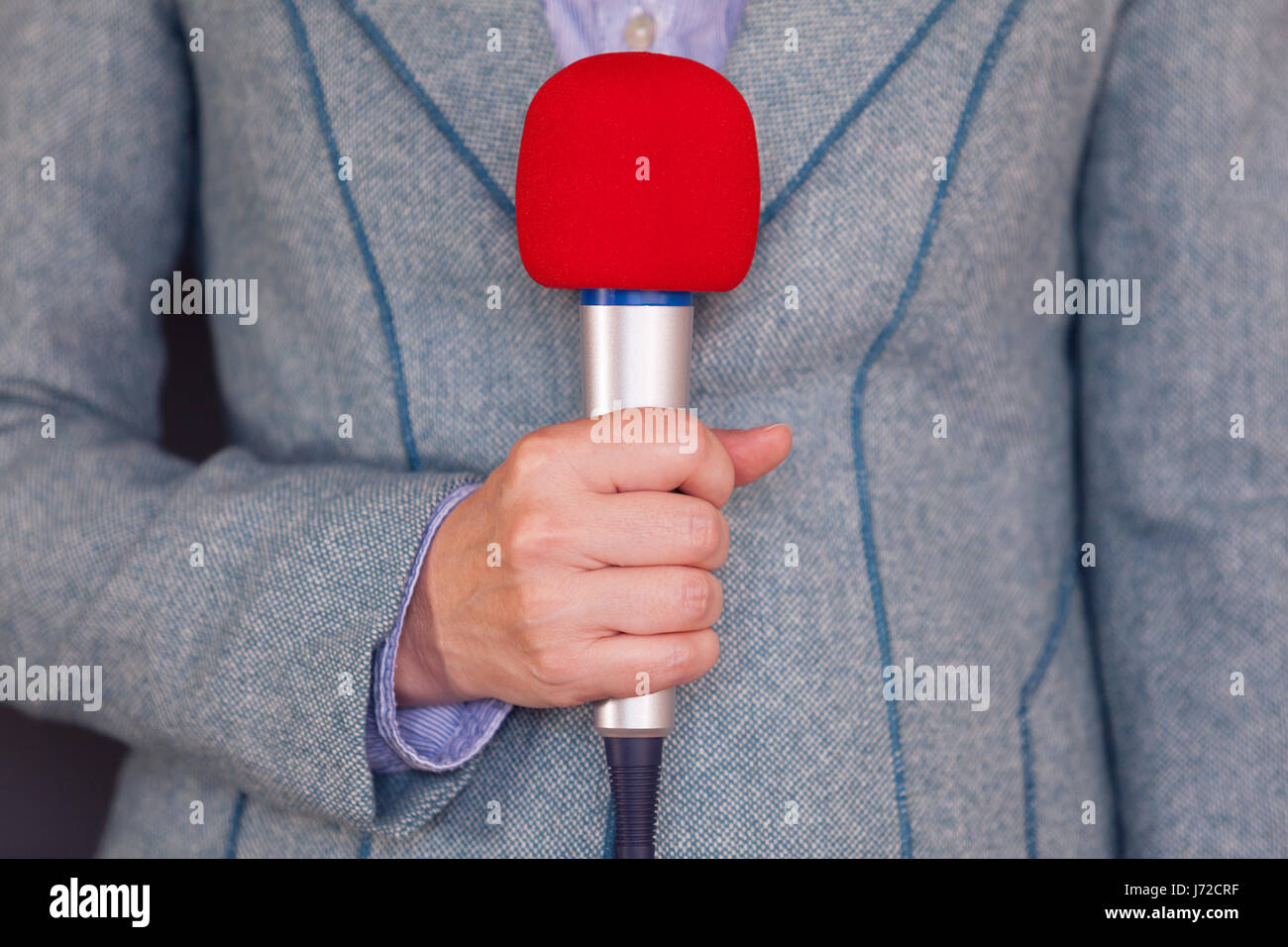 Reporter holding microphone. Press reporting. News Stock Photo - Alamy