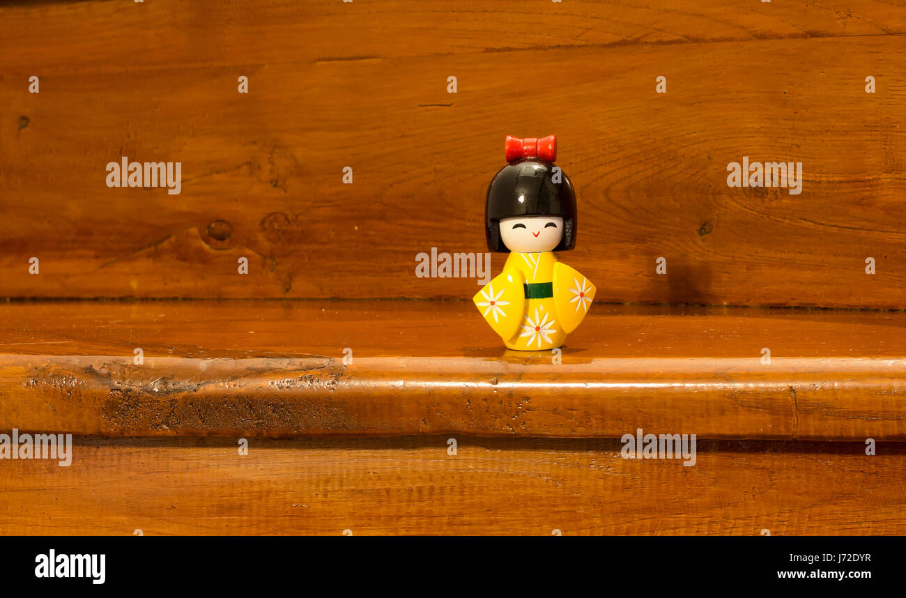 Traditional, yellow, wooden Japanese toy (souvenier) with wood ...