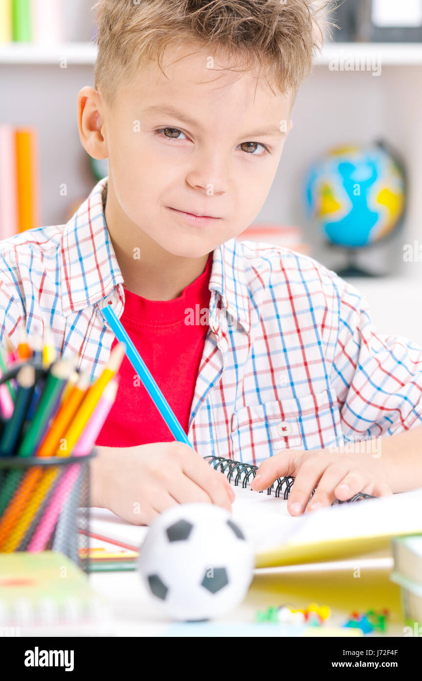 Boy doing homework Stock Photo - Alamy