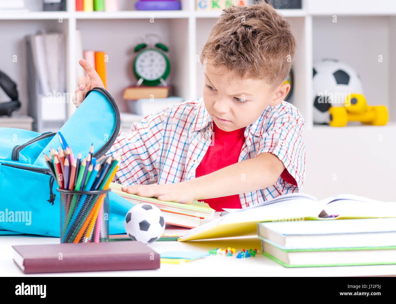 Boy doing homework Stock Photo - Alamy