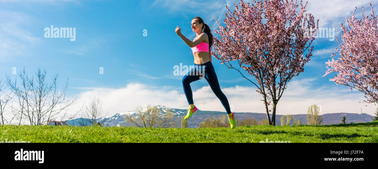 Woman sport running on hill for fitness Stock Photo - Alamy