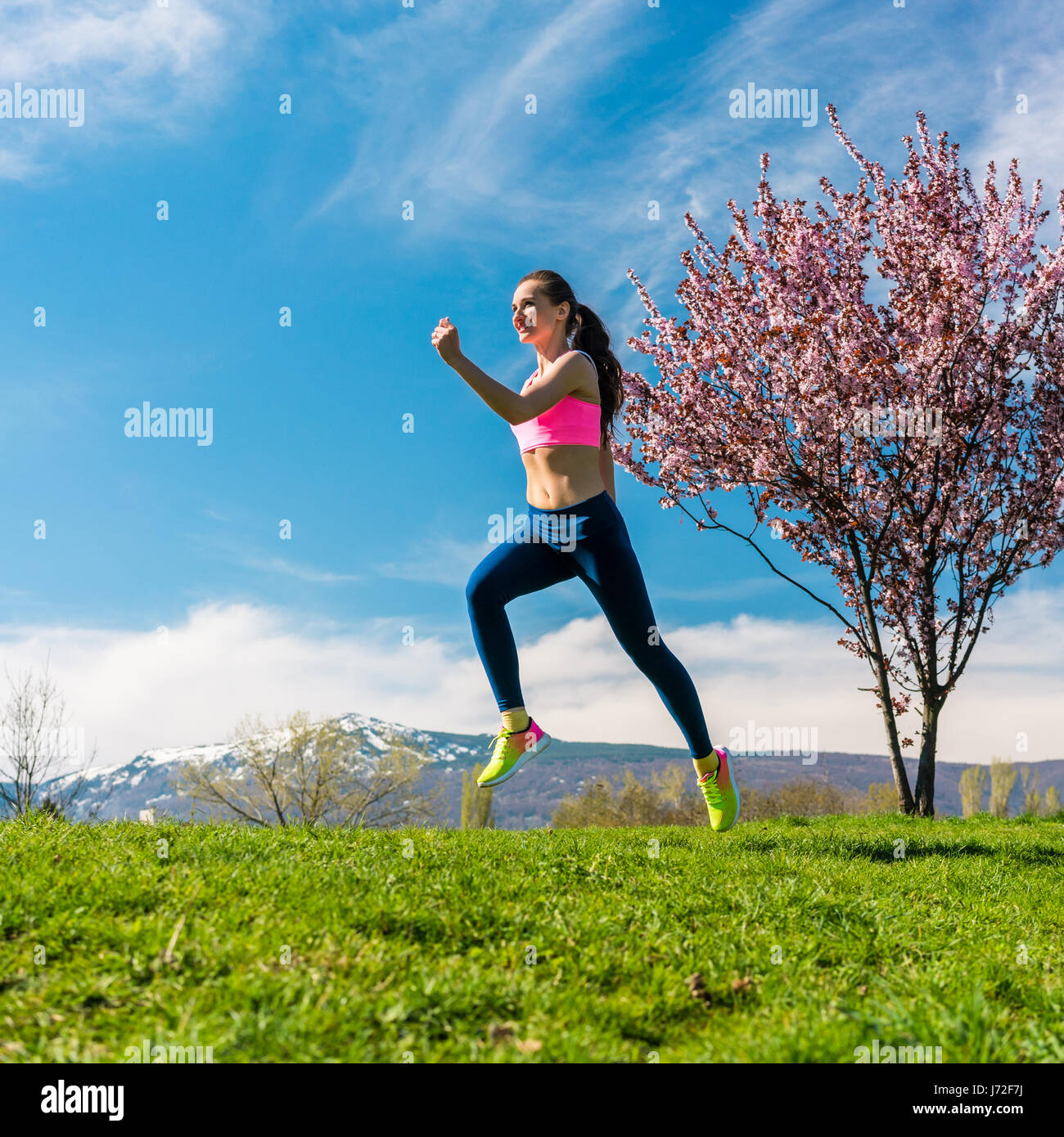 Woman sport running on hill for fitness Stock Photo - Alamy