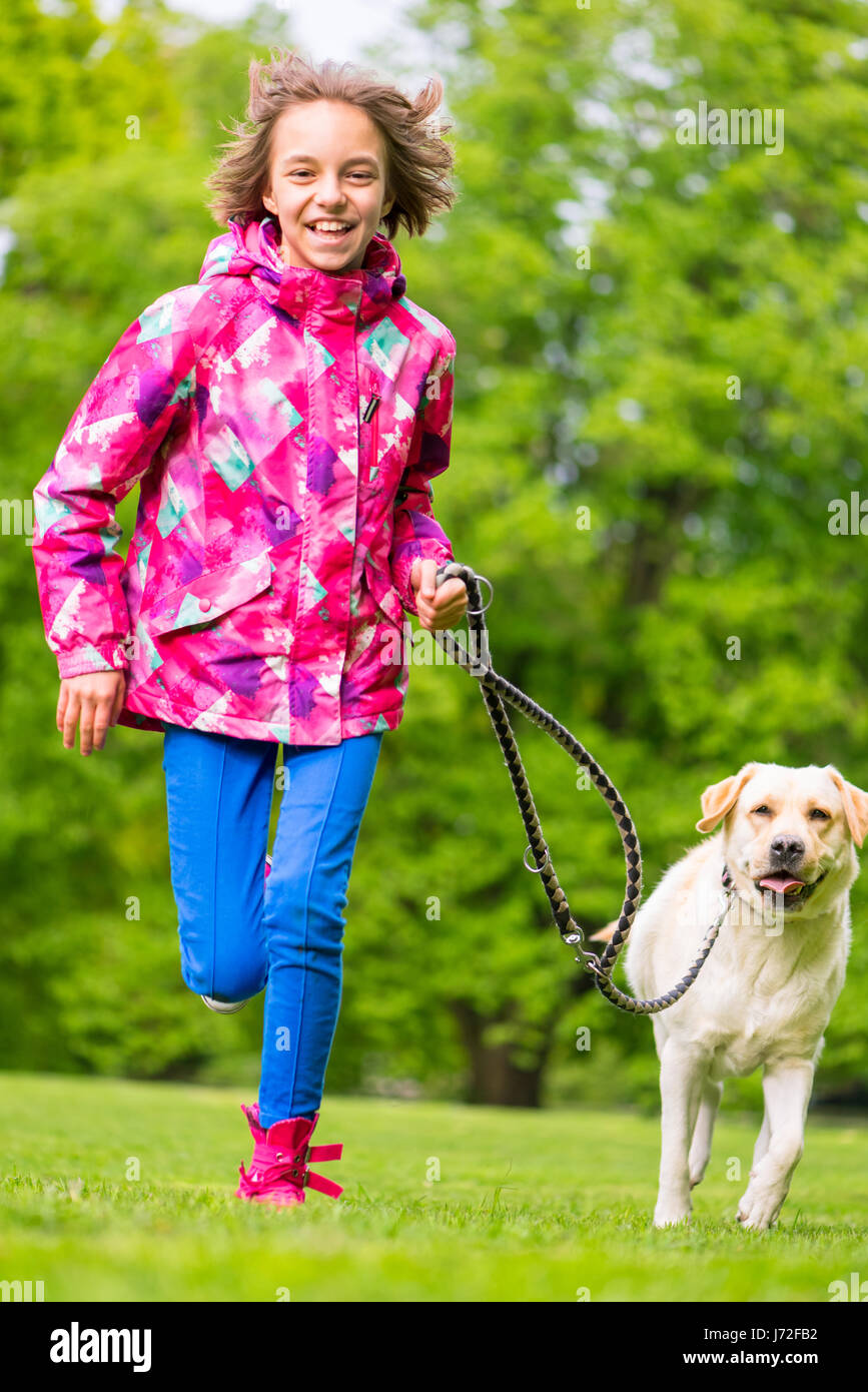 Girl with labrador retriever dog Stock Photo - Alamy