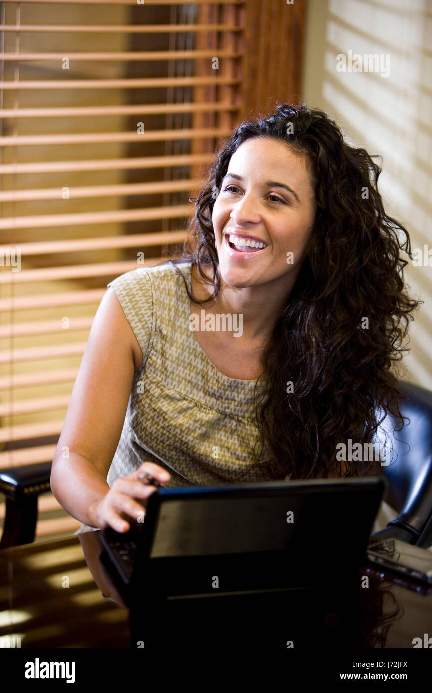 woman office laptop notebook computers computer laugh laughs laughing ...