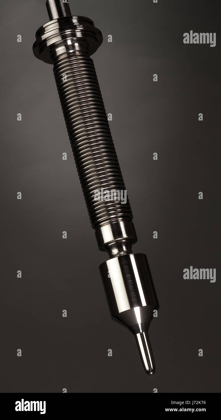 shiny metal spindle with spring Stock Photo - Alamy