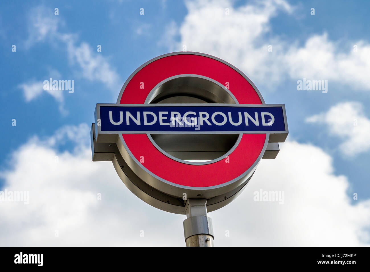 London, UK - 2nd of April, 2017: London Underground sign with blue sky ...