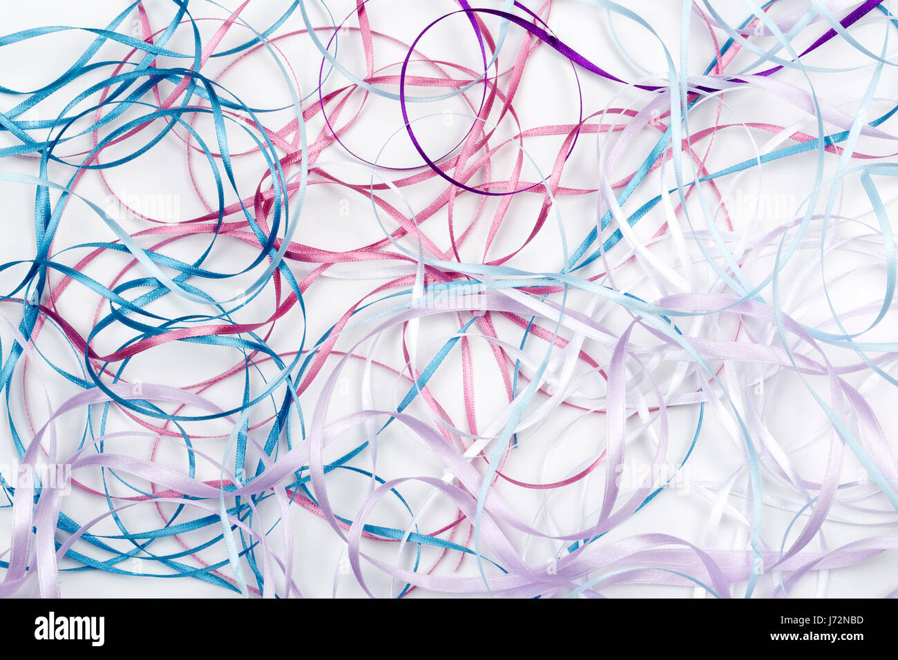 Macro, studio shot of silk ribbons on white background Stock Photo - Alamy