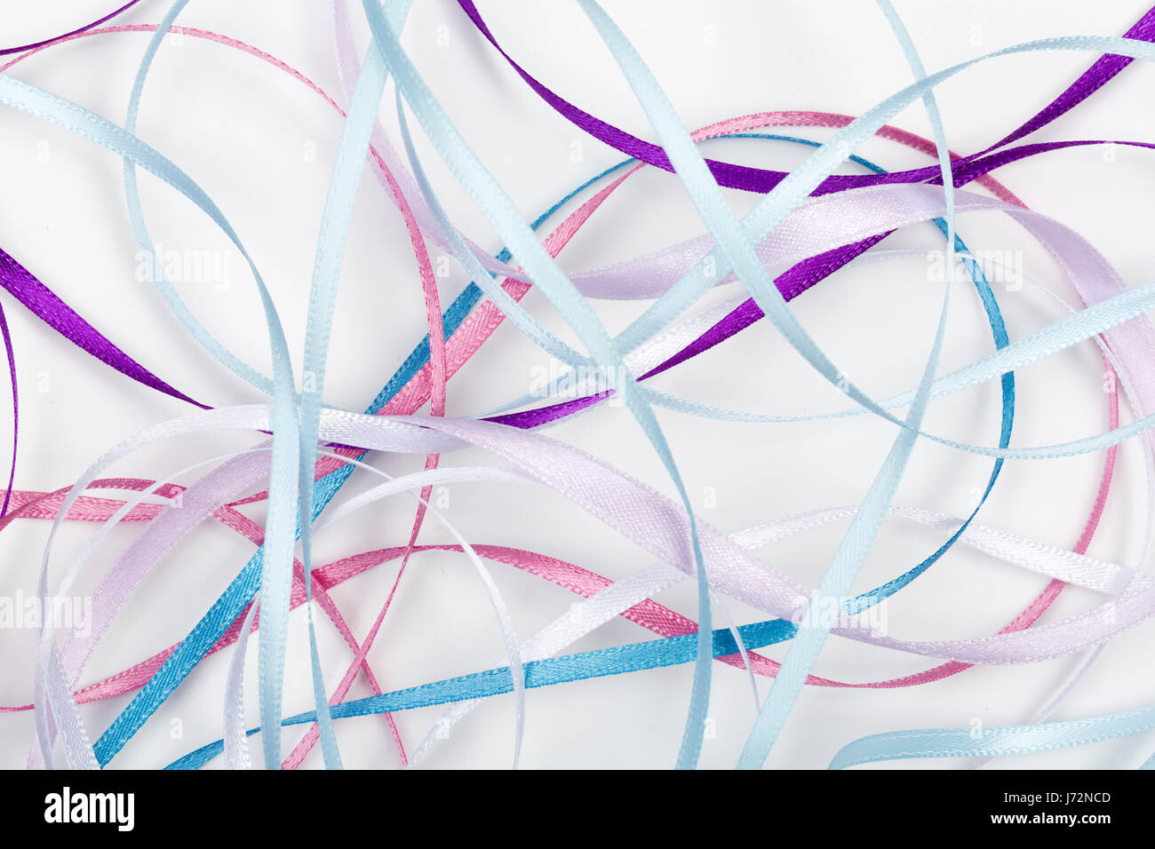 Macro, studio shot of silk ribbons on white background Stock Photo - Alamy