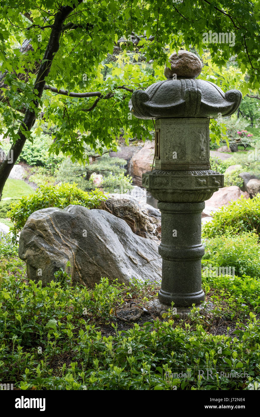 a stone lantern in a Japanese garden Stock Photo - Alamy