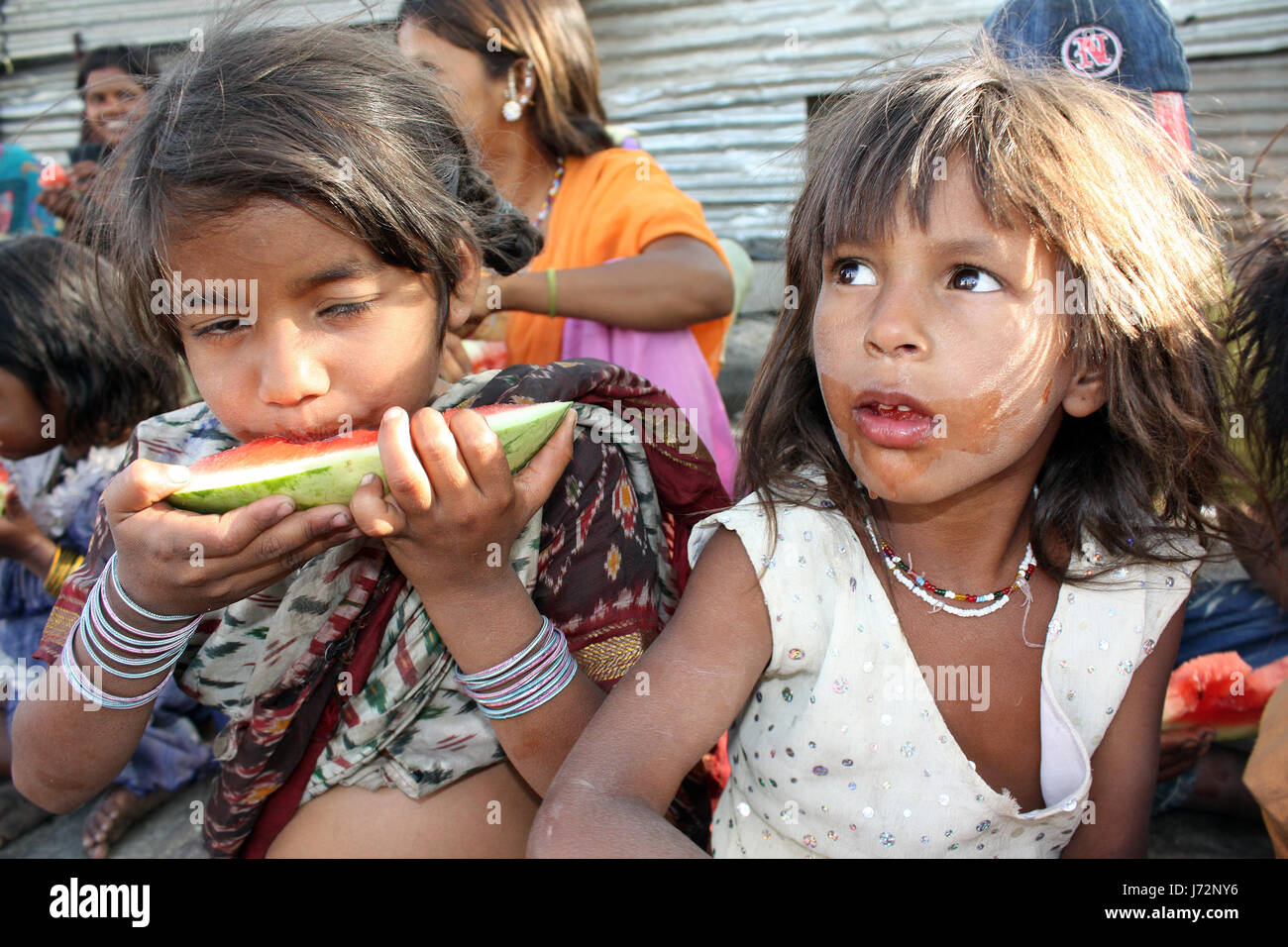 Indian kids eating fruit hi-res stock photography and images - Alamy