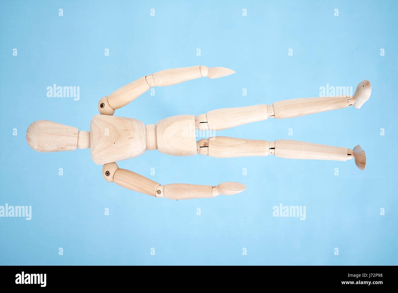 A studio photo of a wooden toy mannequin Stock Photo - Alamy