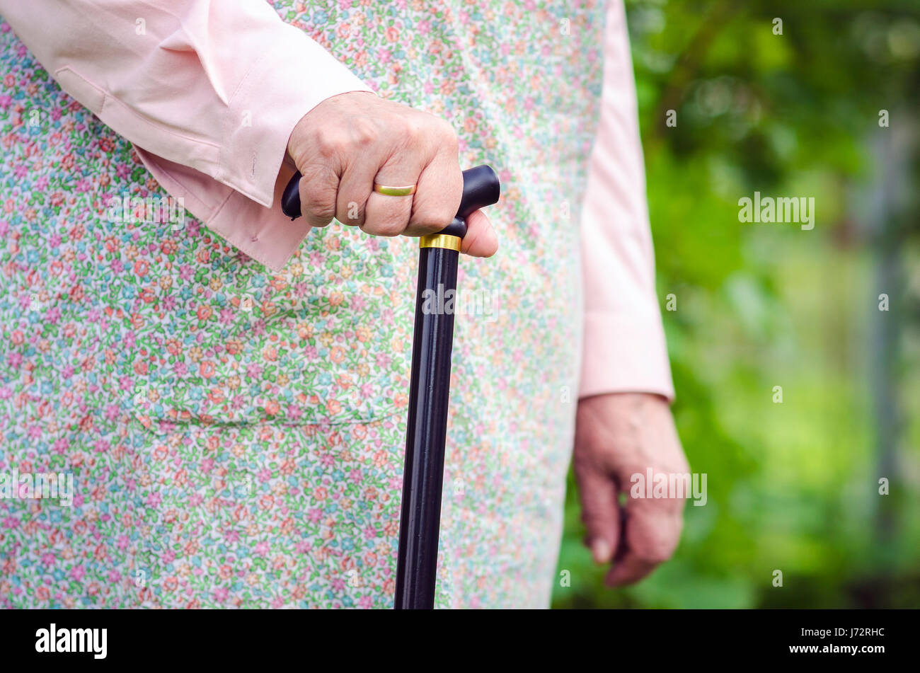 Old woman walking stick hi-res stock photography and images - Alamy