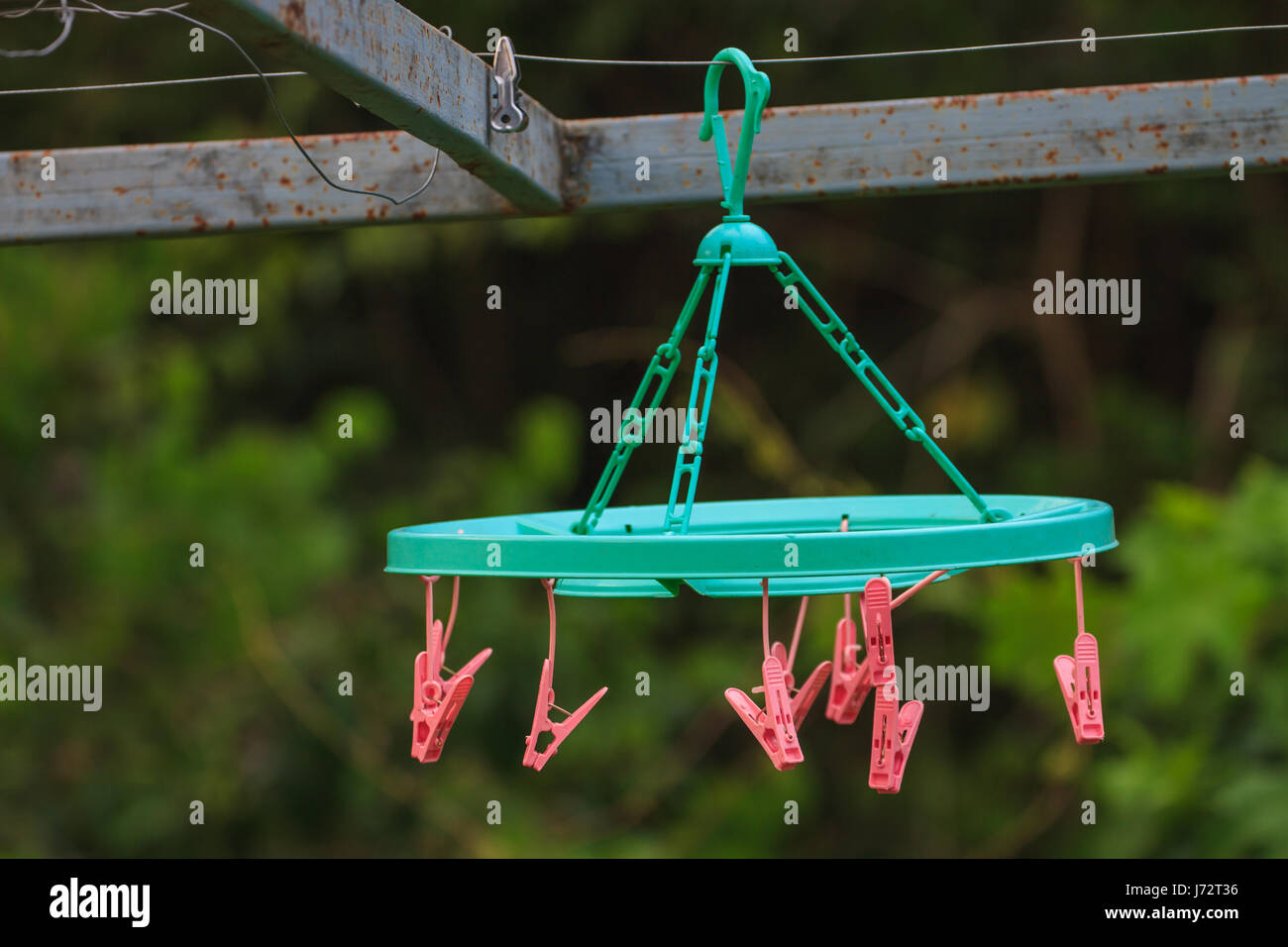 clothes pins on a washing line close up Stock Photo - Alamy