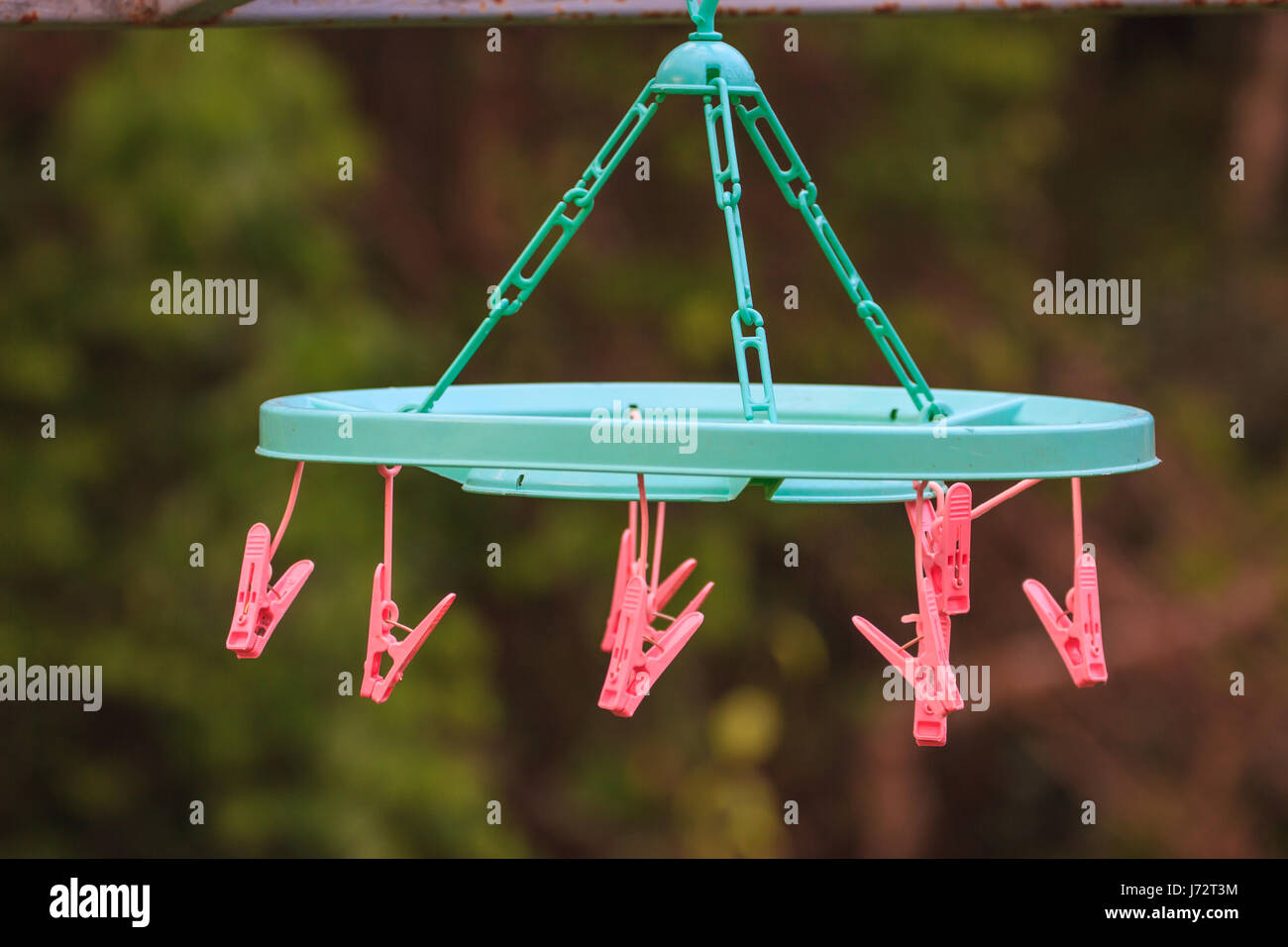 clothes pins on a washing line close up Stock Photo - Alamy