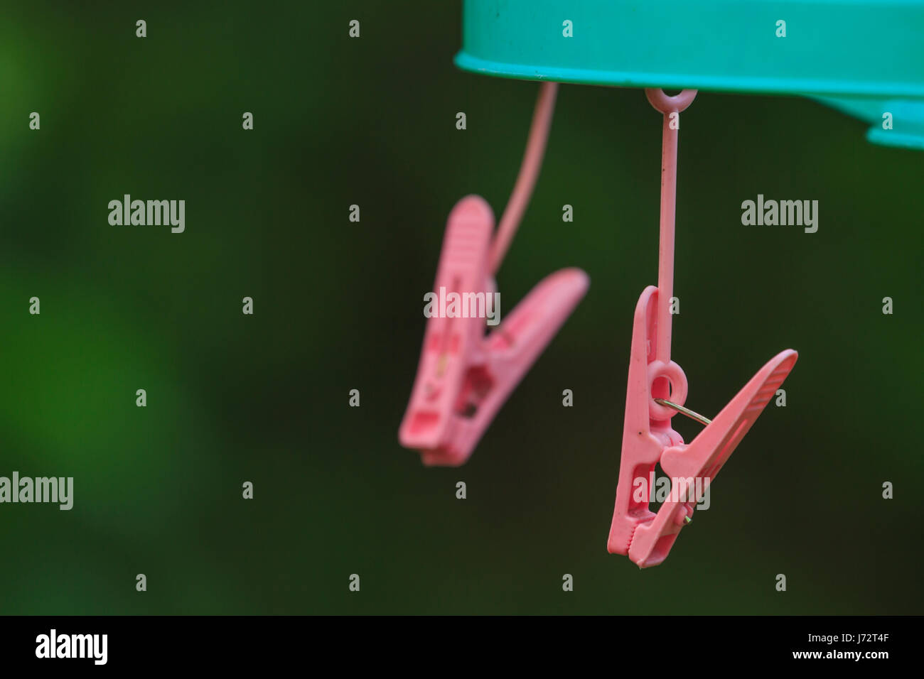 clothes pins on a washing line close up Stock Photo - Alamy