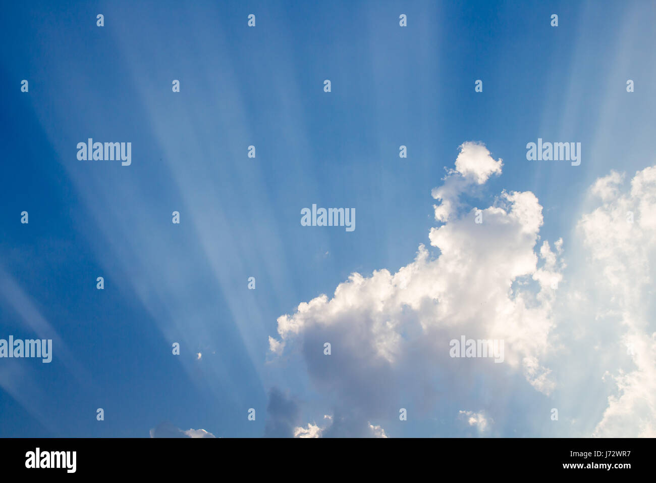sun beam on blue sky Stock Photo - Alamy