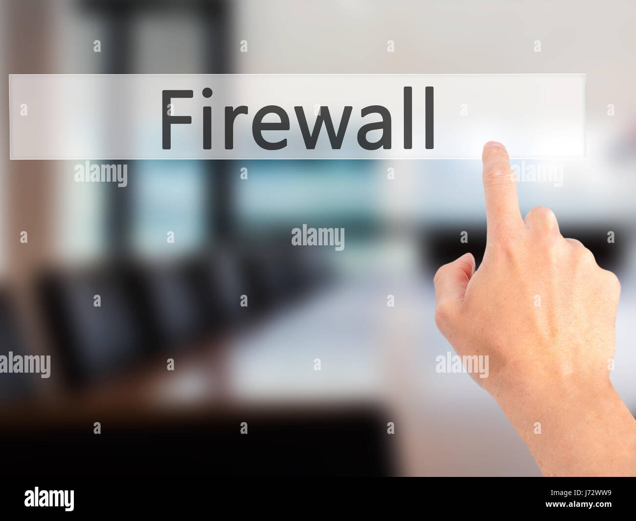 Firewall - Hand pressing a button on blurred background concept ...