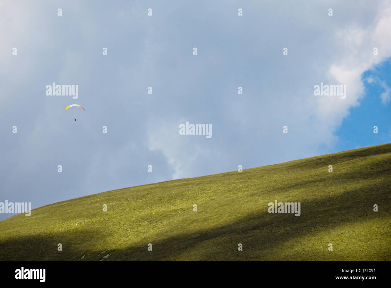 parachute clouds mountain nature paraglider blue big large enormous ...