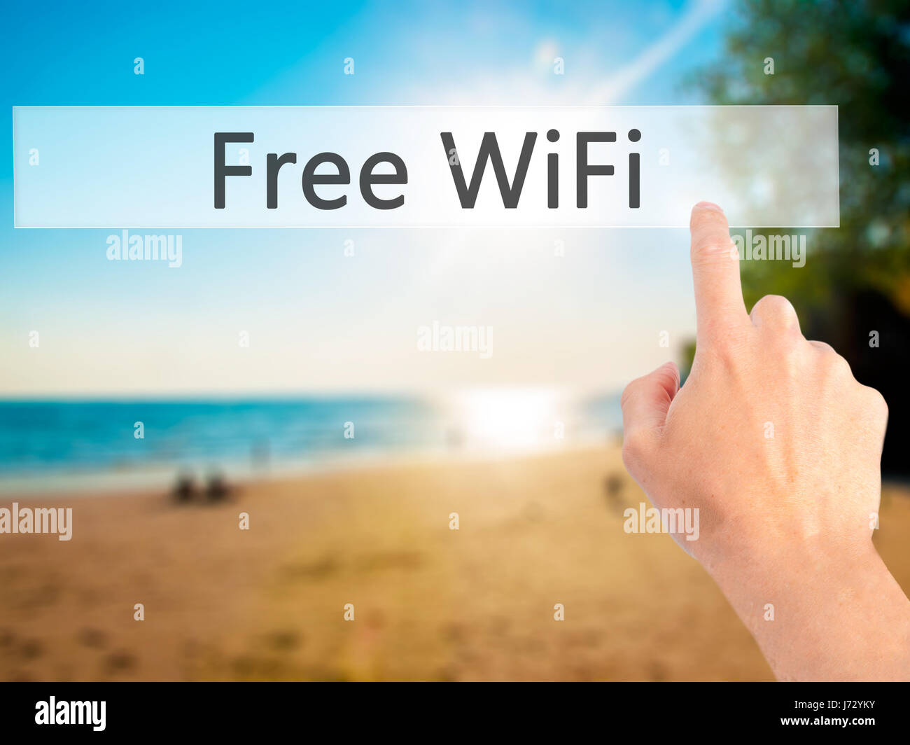 Free WiFi - Hand pressing a button on blurred background concept ...