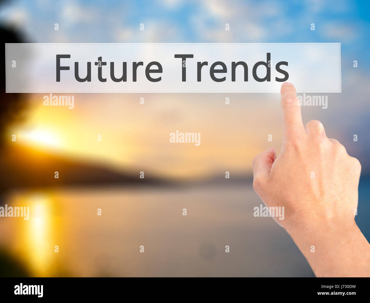 Future Trends - Hand pressing a button on blurred background concept ...