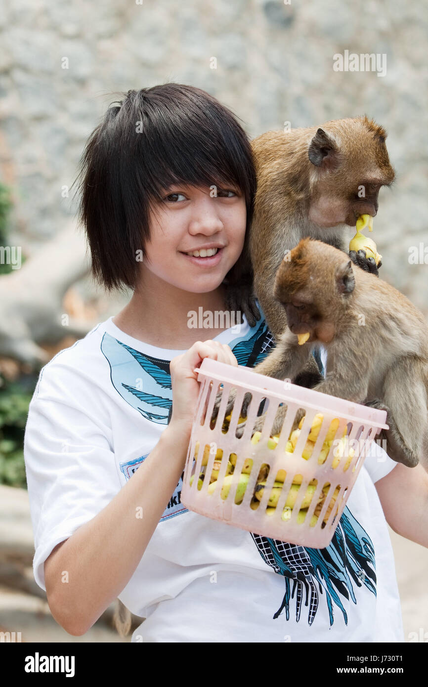 monkey teenager girl girls female animal portrait monkey feed ...