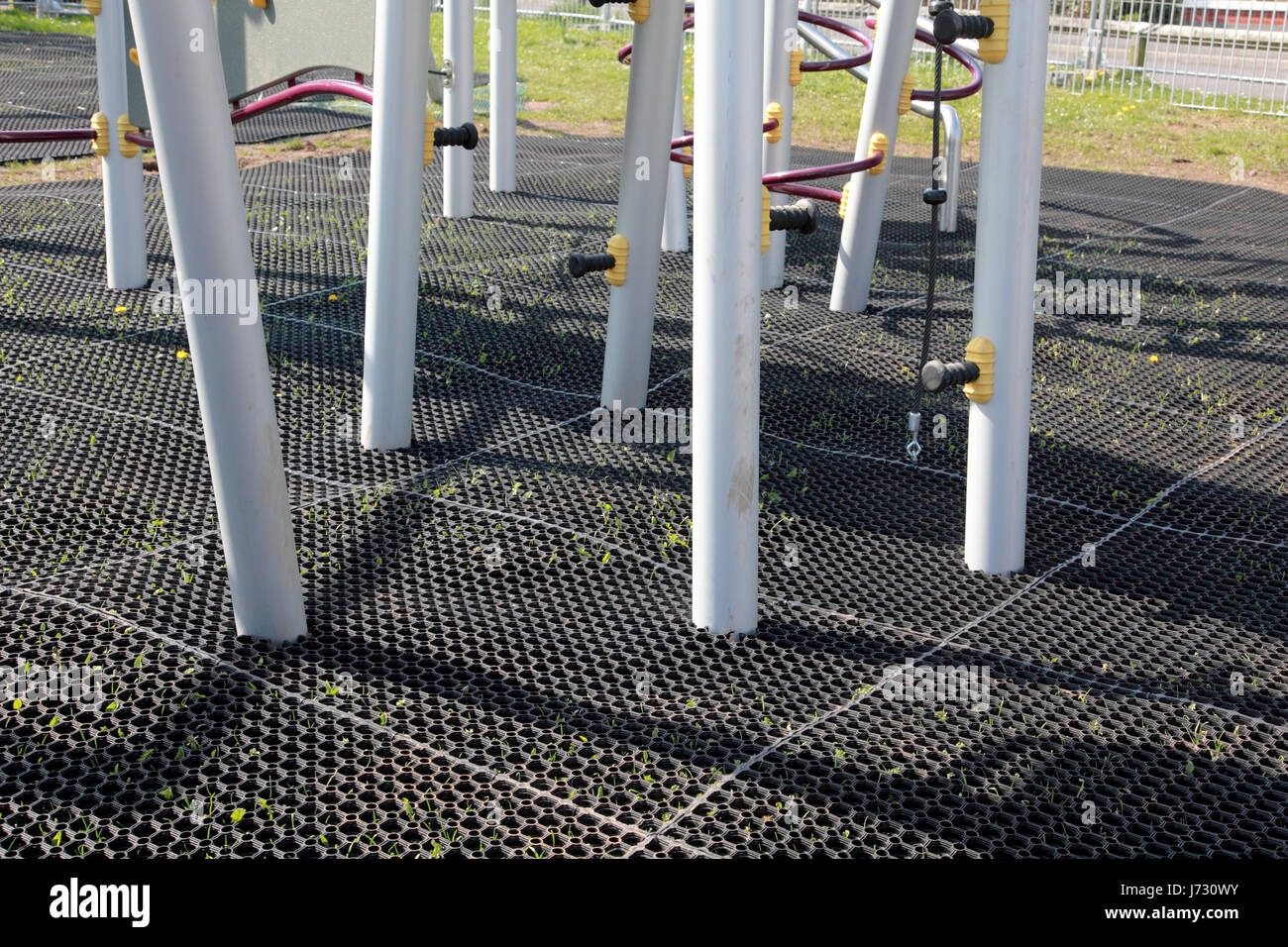 Rubber safety matting allowing for the growth of grass and water ...