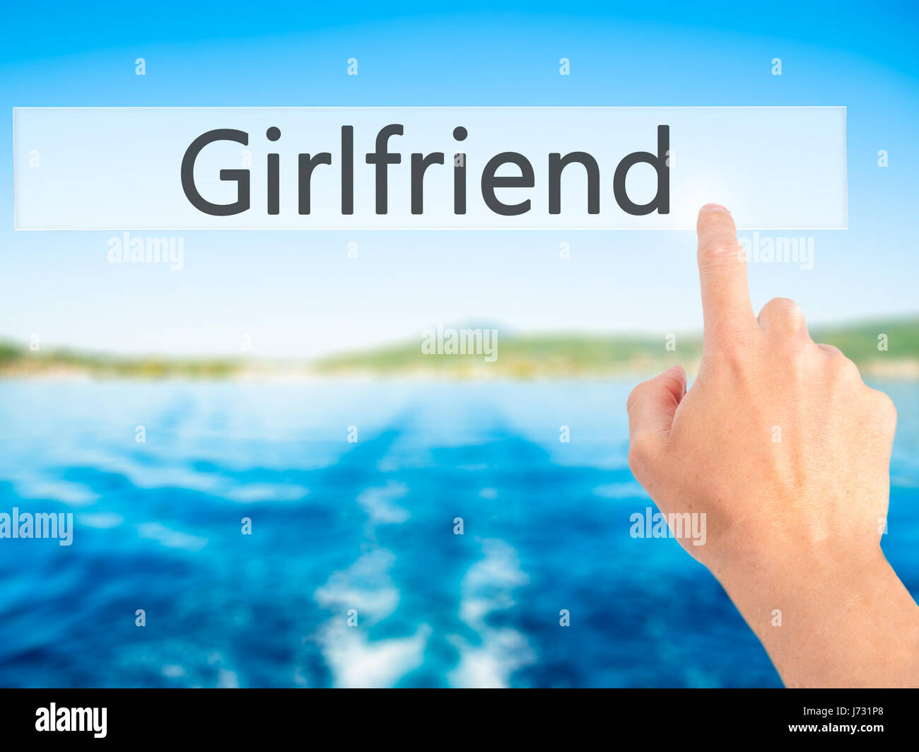 Girlfriend - Hand pressing a button on blurred background concept ...
