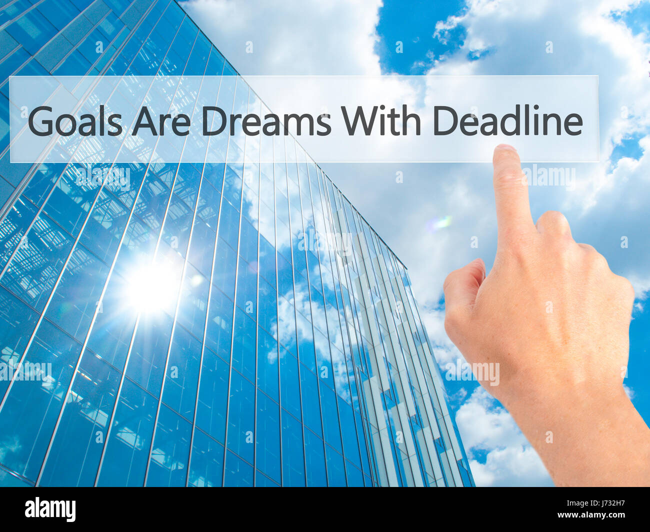 Goals Are Dreams With Deadline - Hand pressing a button on blurred ...