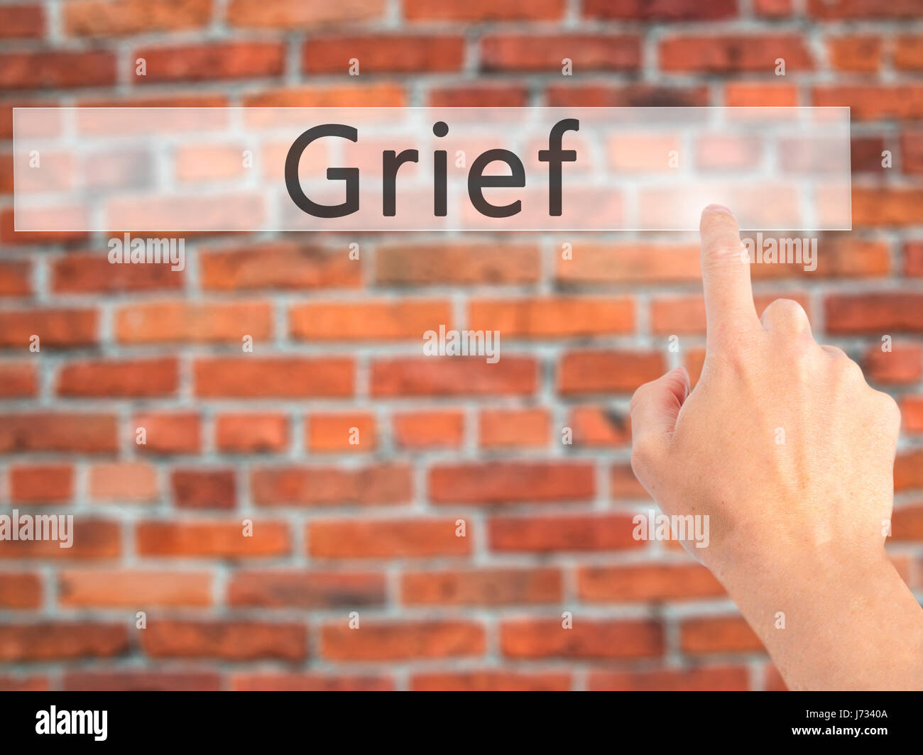 Grief - Hand pressing a button on blurred background concept . Business ...