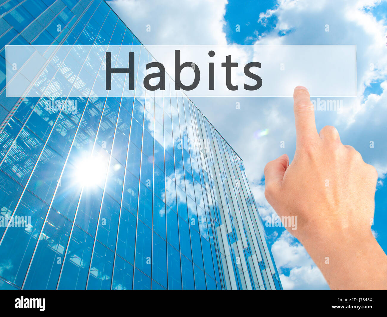 Habits - Hand pressing a button on blurred background concept ...