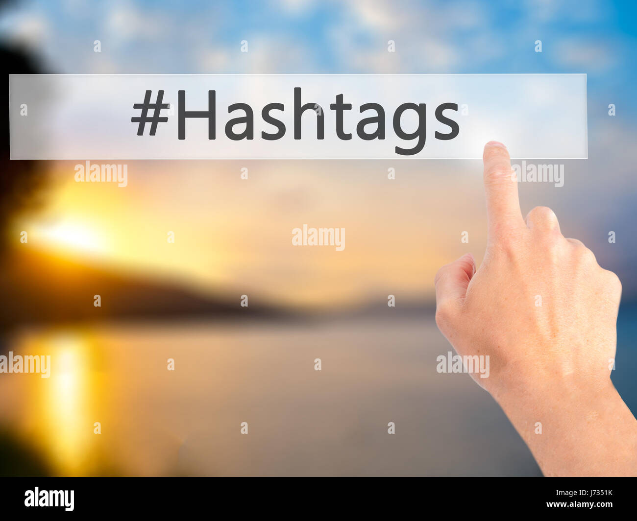 #Hashtags - Hand pressing a button on blurred background concept ...