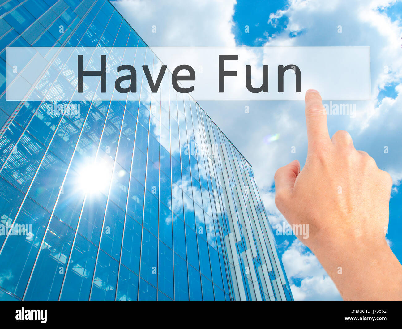 Have Fun - Hand pressing a button on blurred background concept ...