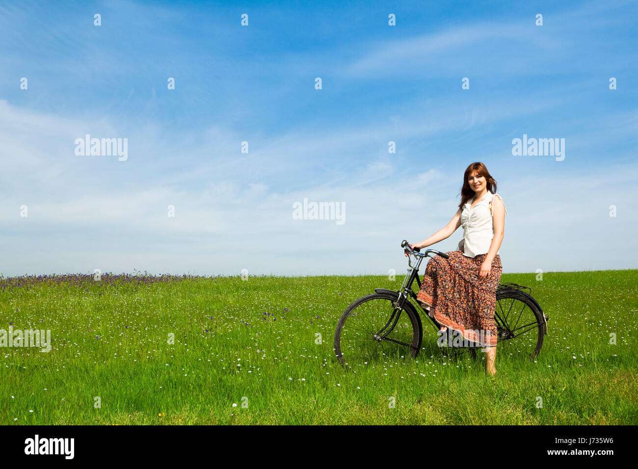 woman beautiful beauteously nice field bike bicycle cycle young younger ...