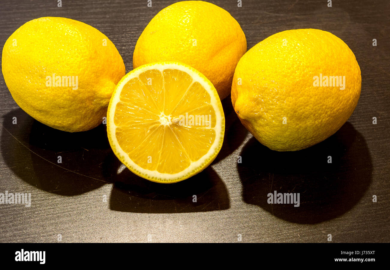 Cute group of lemons on a surface Stock Photo - Alamy