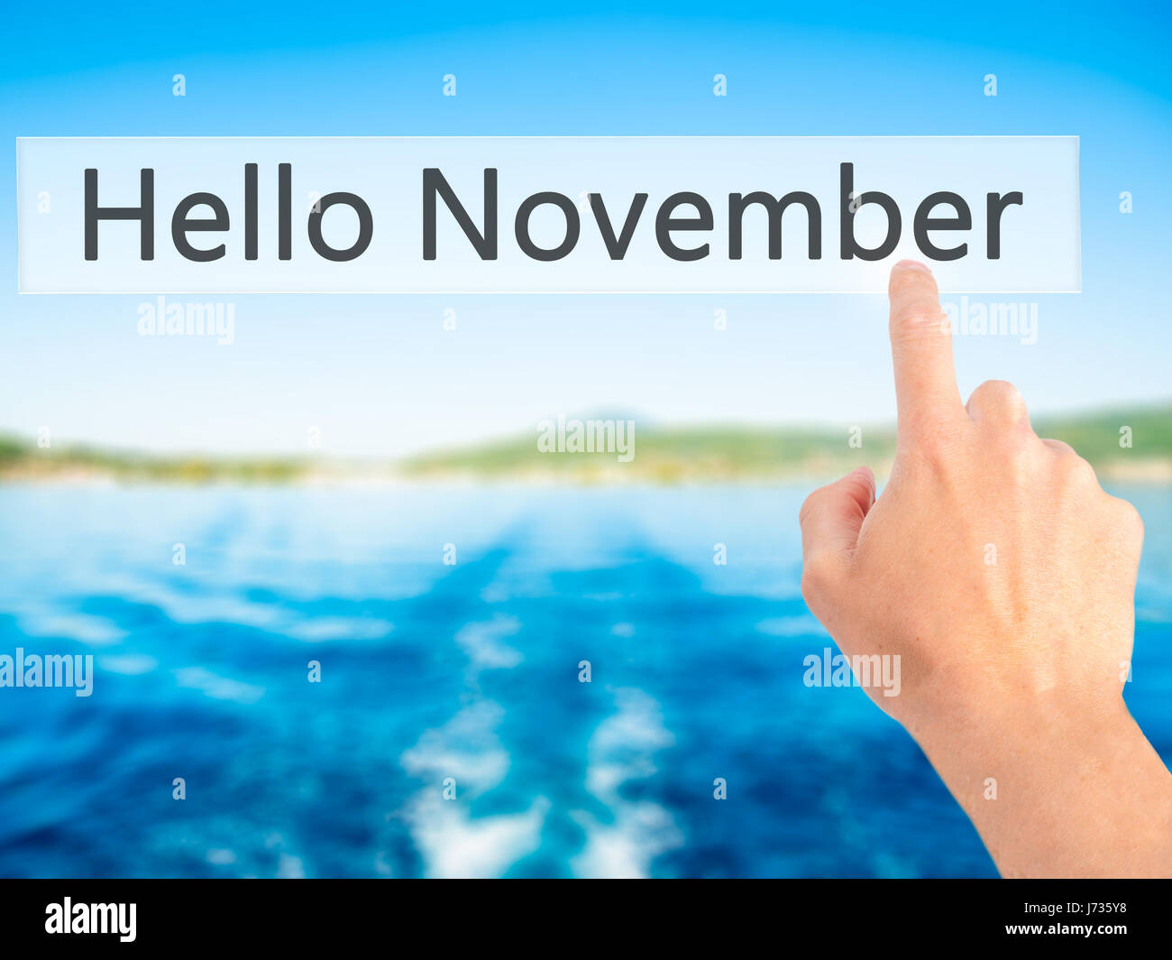 Hello November - Hand pressing a button on blurred background concept ...