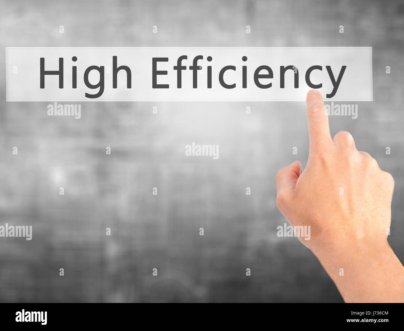 High Efficiency - Hand pressing a button on blurred background concept ...