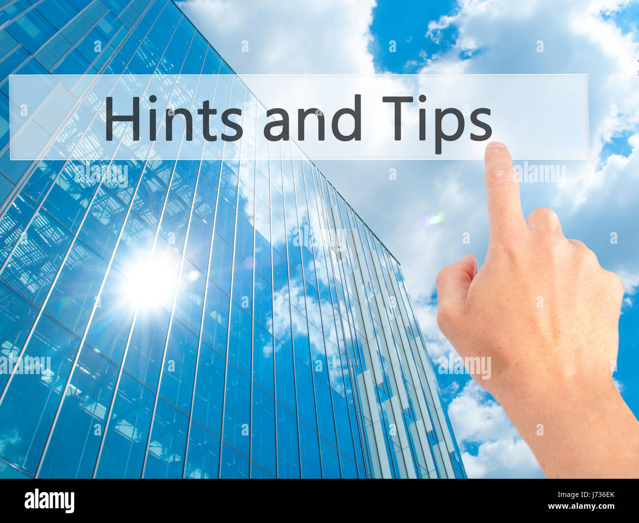 Hints and Tips - Hand pressing a button on blurred background concept ...