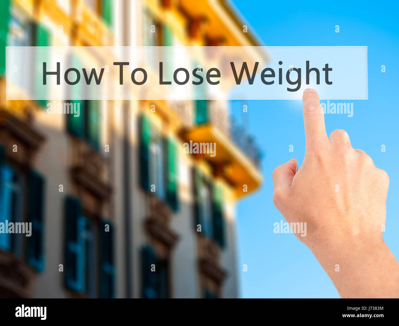 How To Lose Weight - Hand pressing a button on blurred background ...
