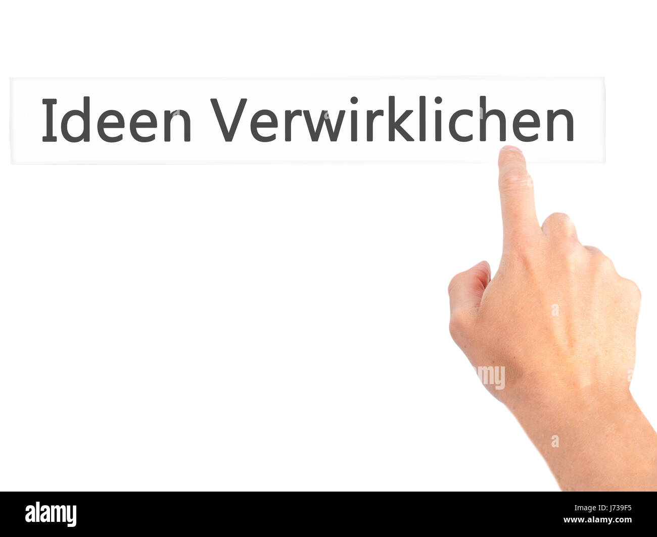 Ideen Verwirklichen ( Realize Ideas in German) - Hand pressing a button ...