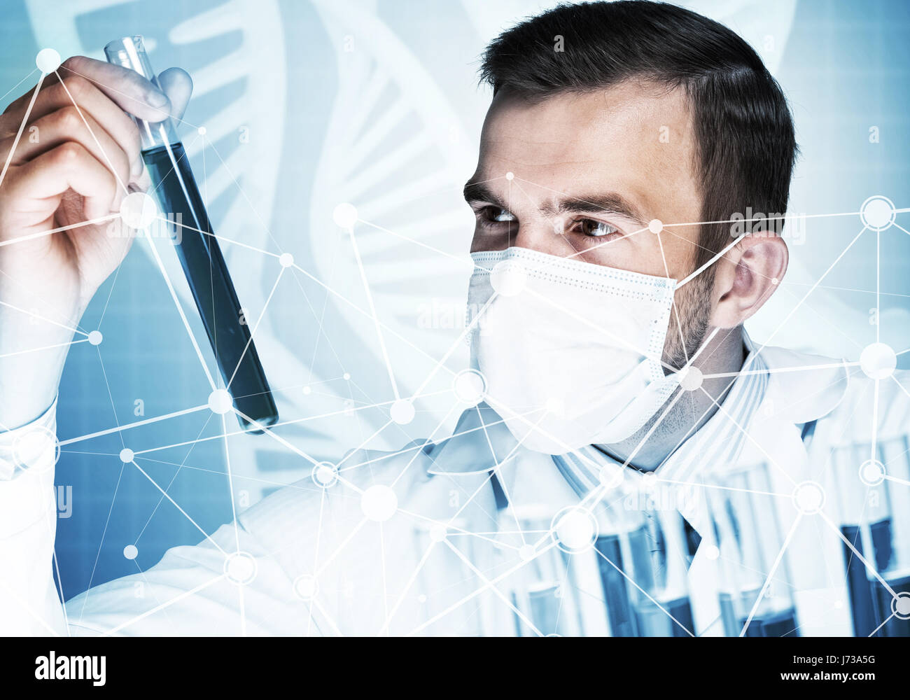 Portrait of concentrated male scientist working with reagents in ...